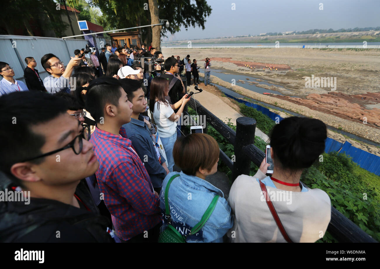 Visitors view the excavation site of the sunken boats owned by peasant ...