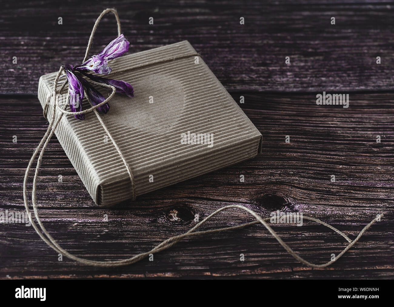 Handmade gift concept. Craft paper recycle gift box with flowers on ...