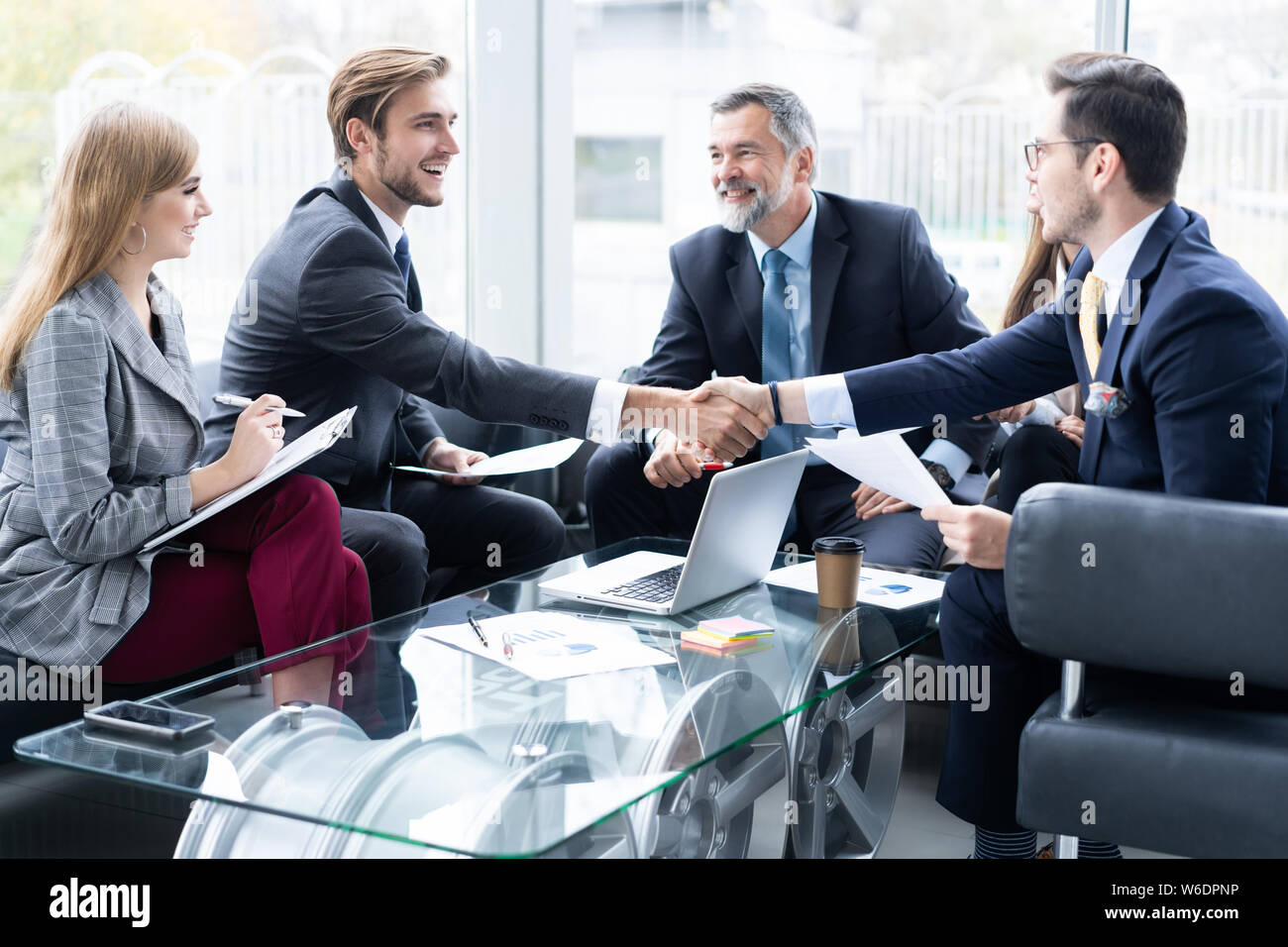 Business people shaking hands, finishing up a meeting. Handshake ... Business people shaking hands, finishing up a meeting. Handshake ...