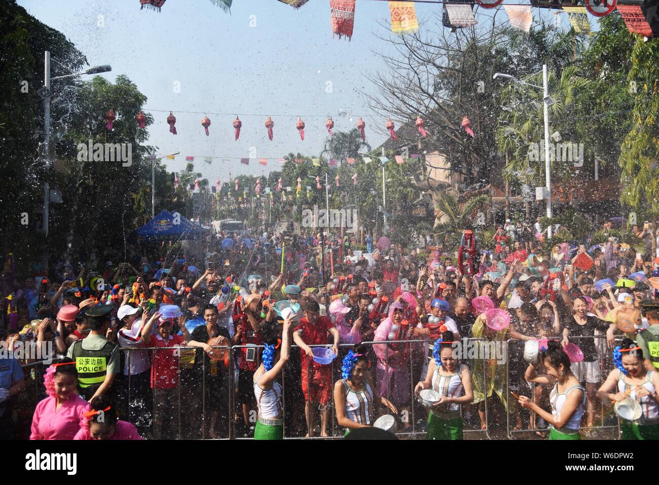 Local people and tourists sprinkle water to celebrate the Water ...