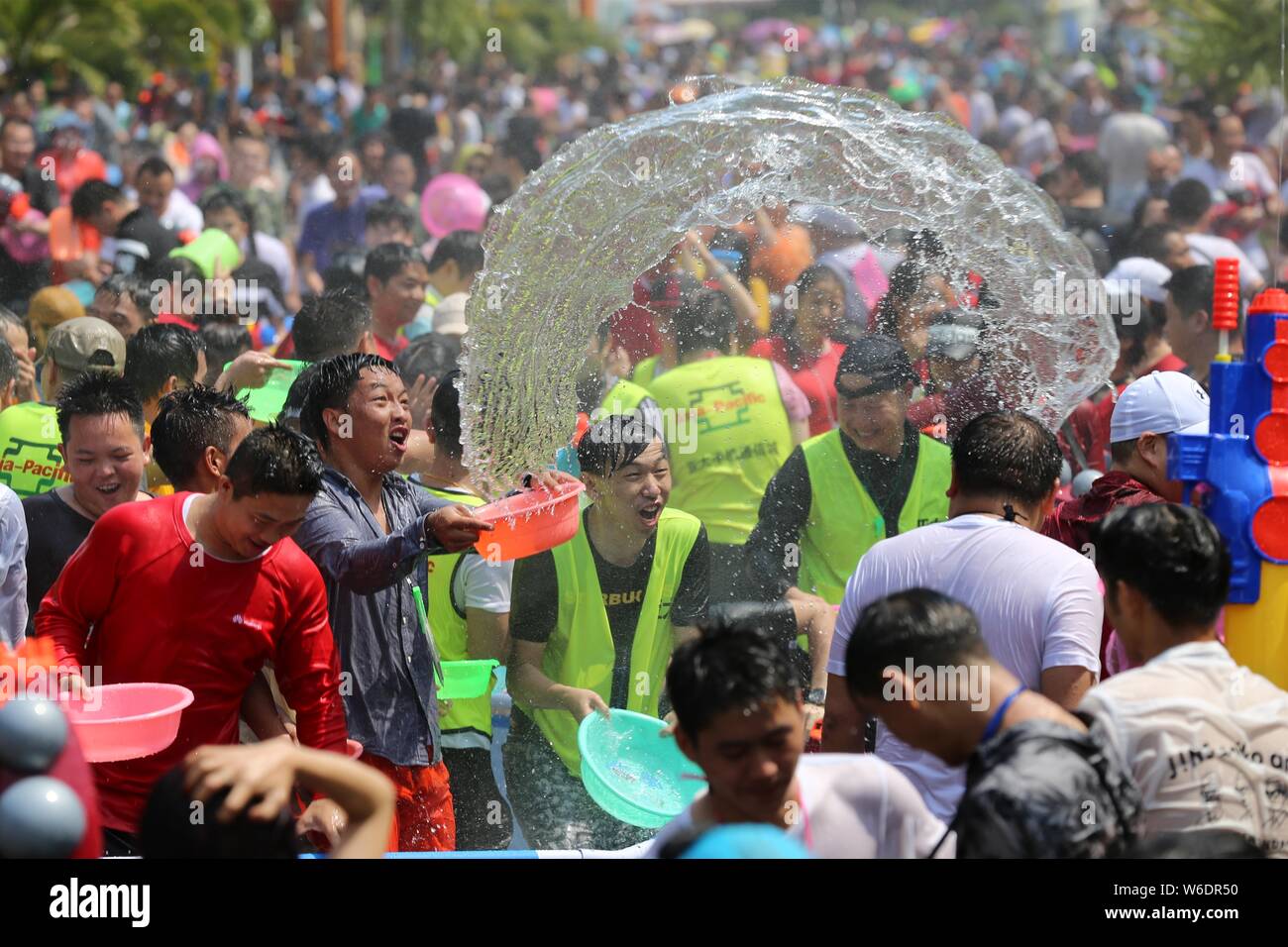 Local people and tourists sprinkle water to celebrate the Water ...