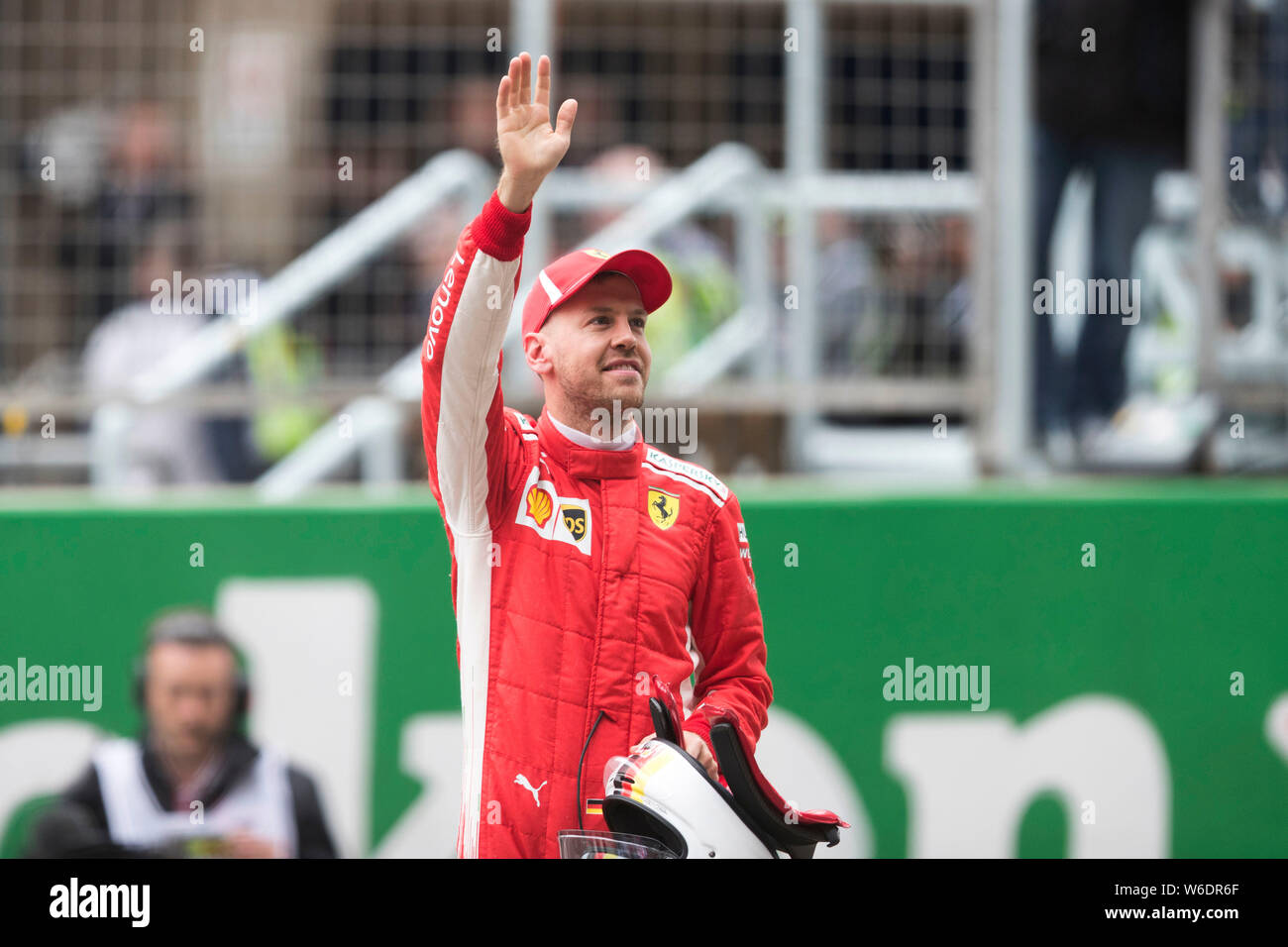 German F1 Sebastian Vettel of Ferrari reacts after winning the pole ...
