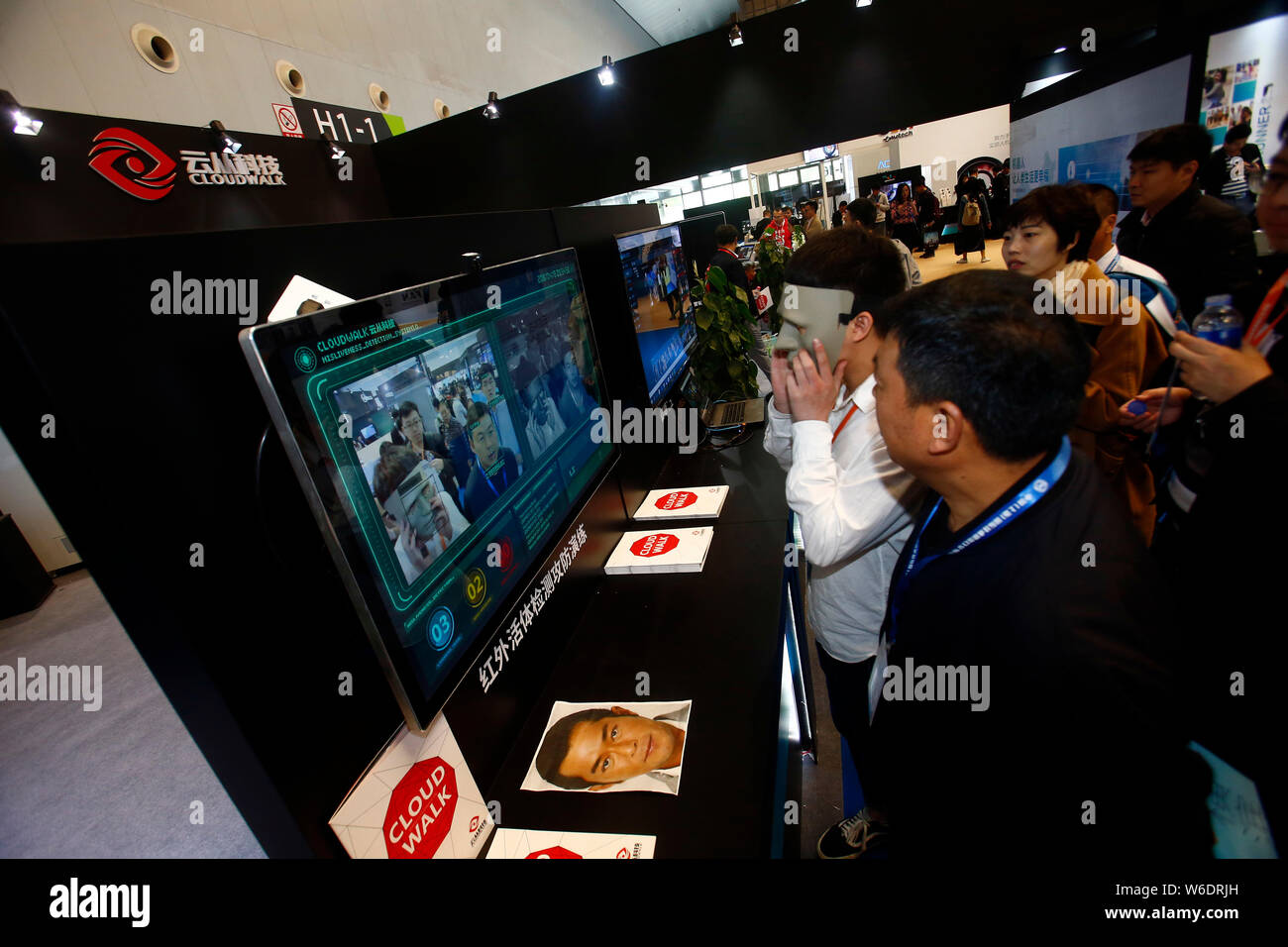 --FILE--Visitors experience the facial recognition at the stand of ...