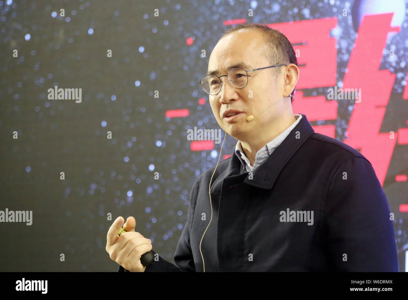 Pan Shiyi, co-founder, Chairman and co-CEO of SOHO China, shows a photo ...