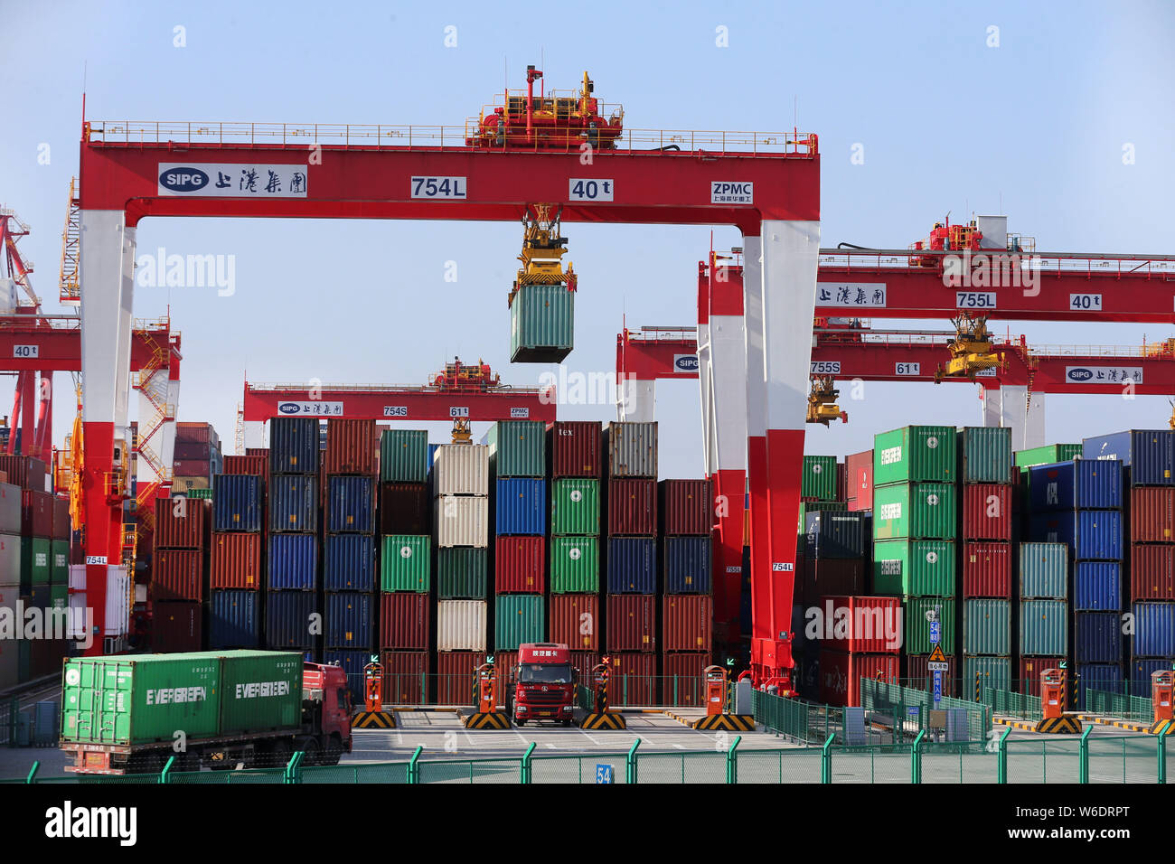 A truck transports a container at the fourth phase of the Yangshan Deep ...