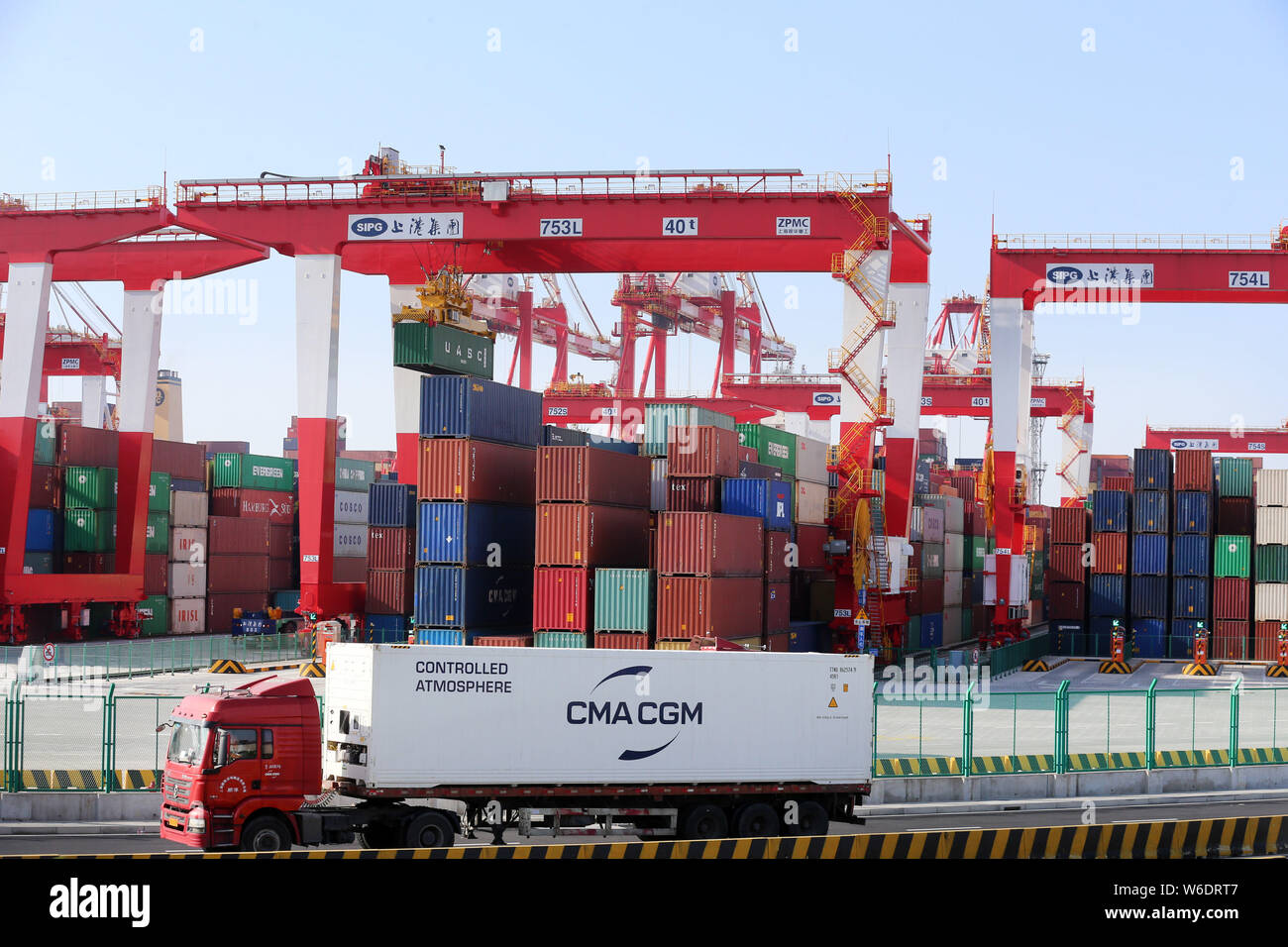 A truck transports a container at the fourth phase of the Yangshan Deep ...