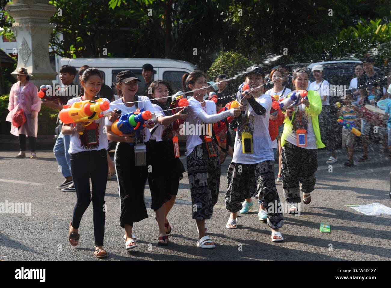 Local people and tourists sprinkle water to celebrate the Water ...