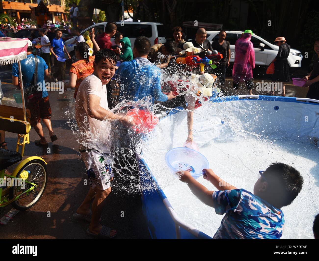 Local people and tourists sprinkle water to celebrate the Water ...