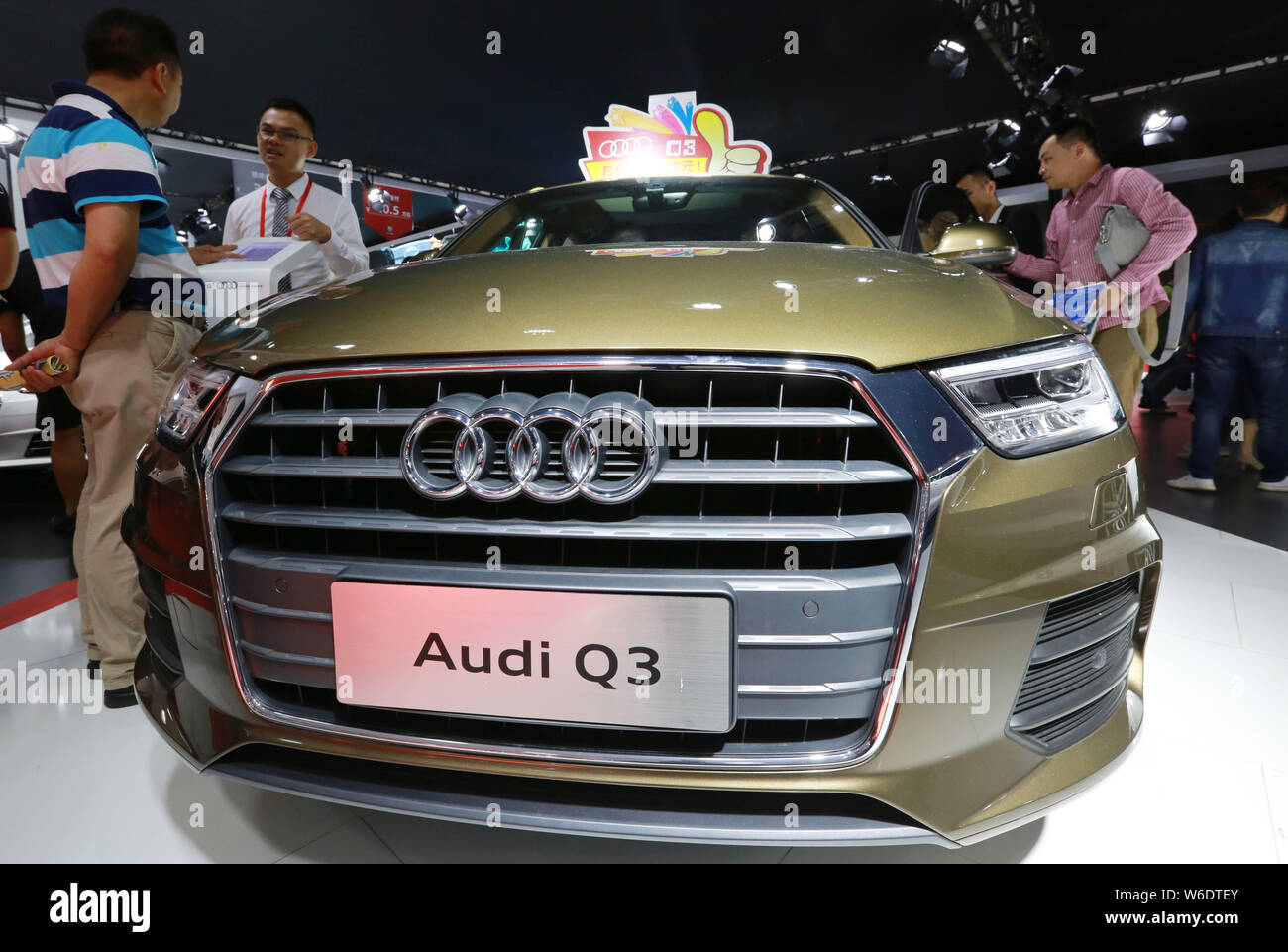 --FILE--Visitors look at an Audi Q3 during an auto show in Haikou city ...