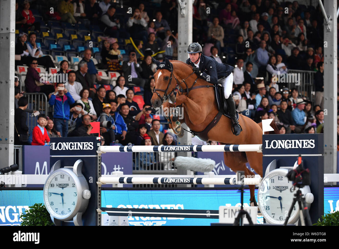 An equestrian competes in the 1.60m Longines Grand Prix Against the ...