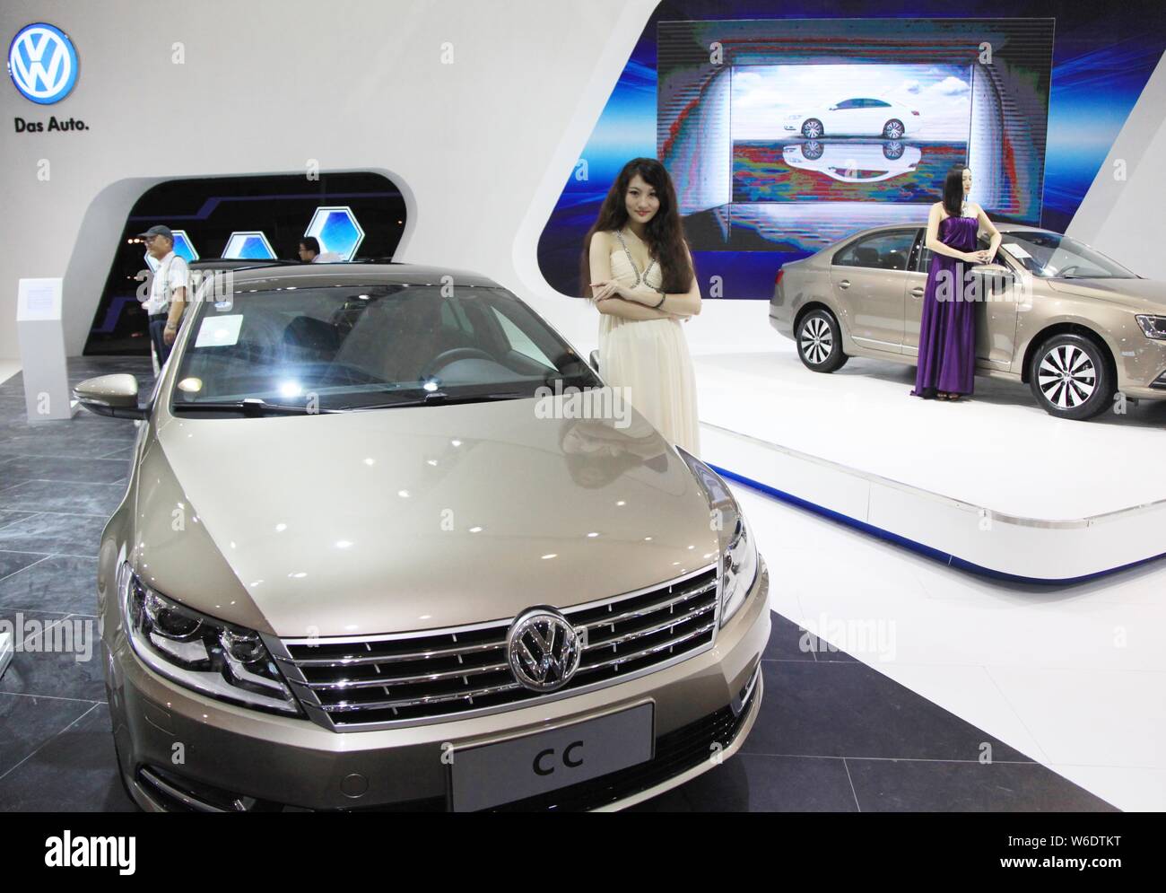 --FILE--Model present cars at the stand of Volkswagen during the 14th ...