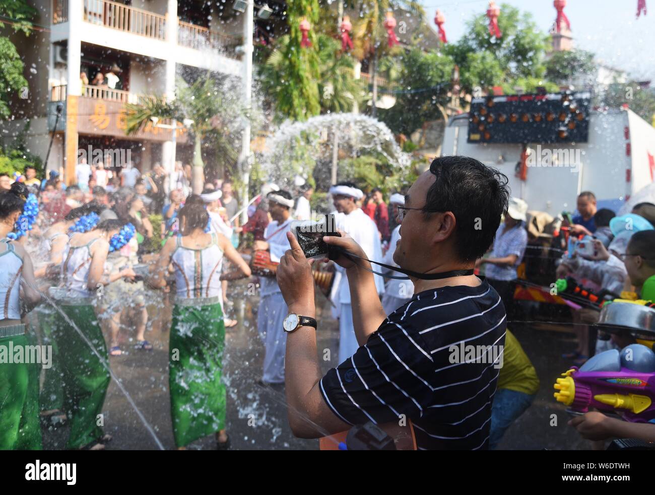 Local people and tourists sprinkle water to celebrate the Water ...
