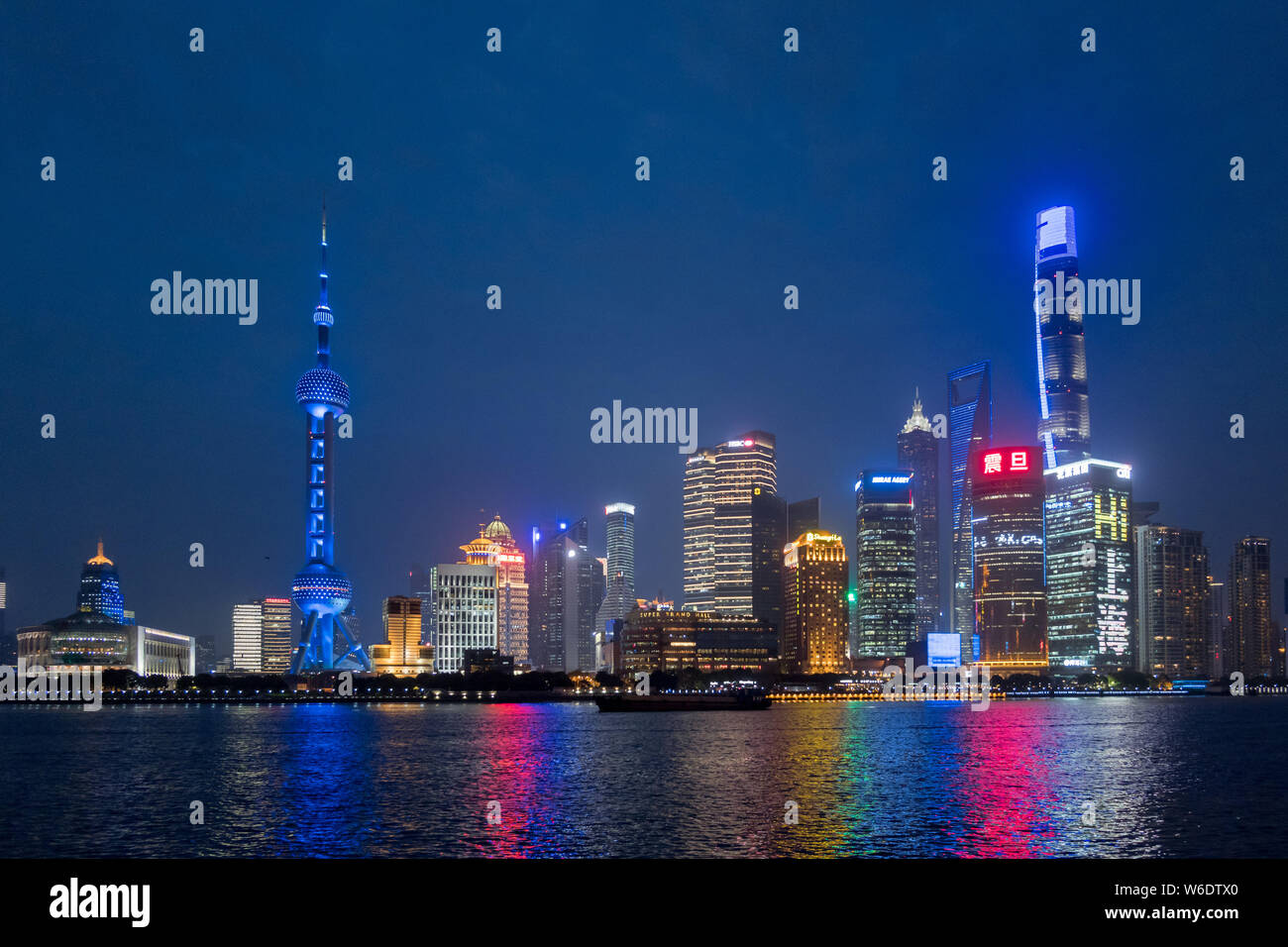 The Shanghai Tower, tallest right, and the Oriental Pearl TV Tower ...
