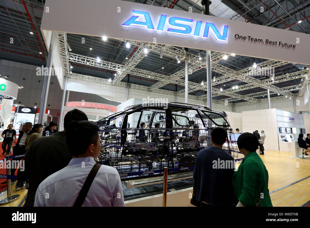 --FILE--People visit the stand of Aisin Automotive during the 16th ...