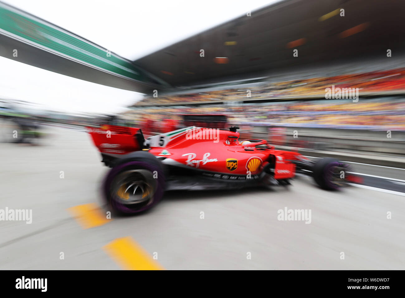 German F1 Sebastian Vettel of Ferrari steers his car during the ...