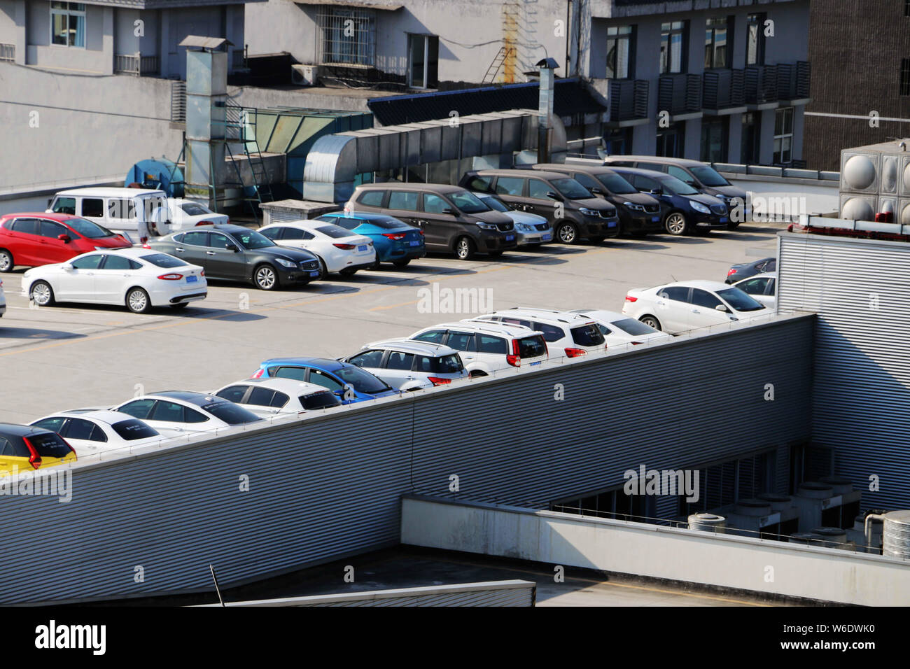 Vehicles are lined up on an 8-storey rooftop parking lot in Chongqing ...