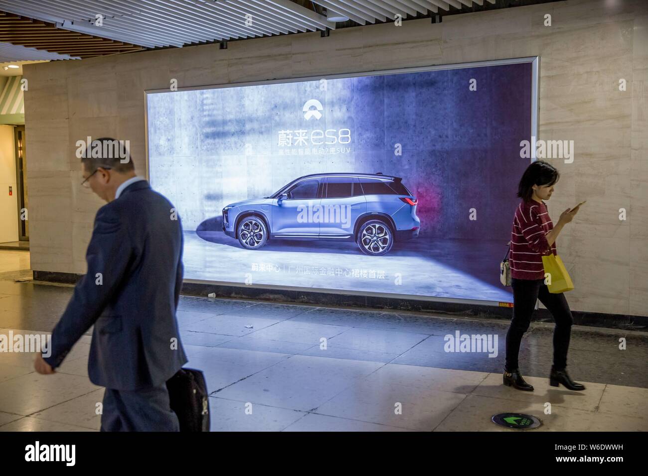 --FILE--Pedestrians walk past the fourth Nio's user center, NIO House ...