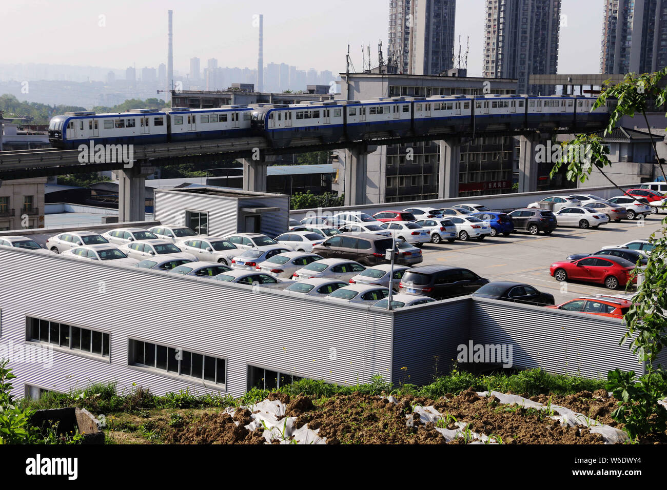 Vehicles are lined up on an 8-storey rooftop parking lot in Chongqing ...