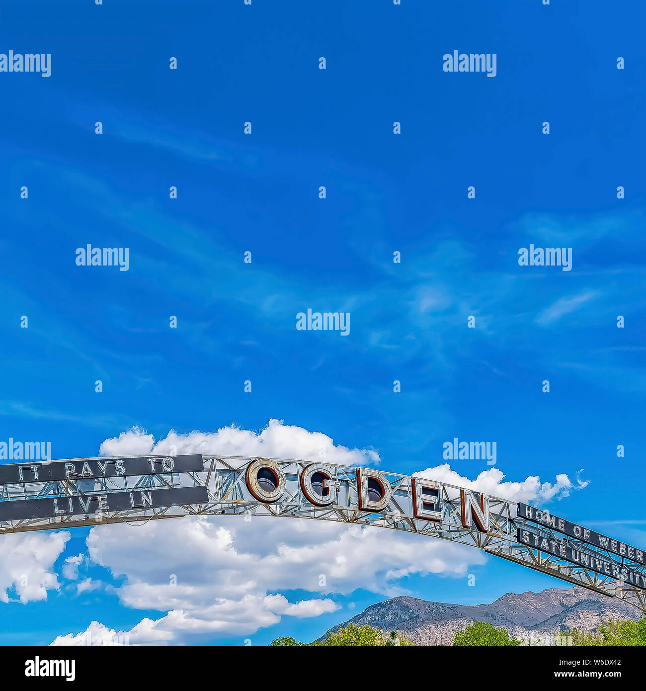 Square frame Welcome arch at the city of Ogden Utah against vivid blue ...