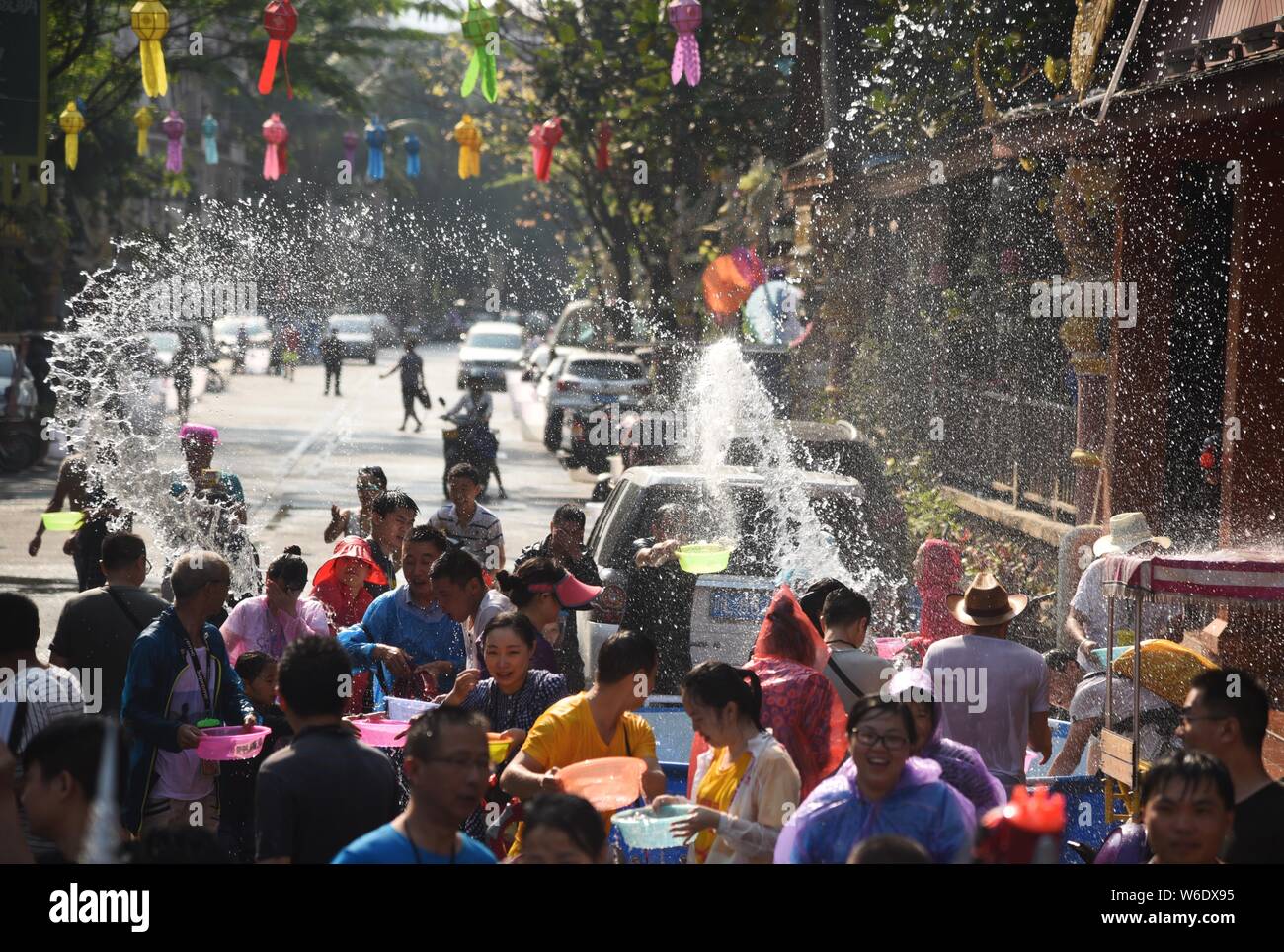 Local people and tourists sprinkle water to celebrate the Water ...