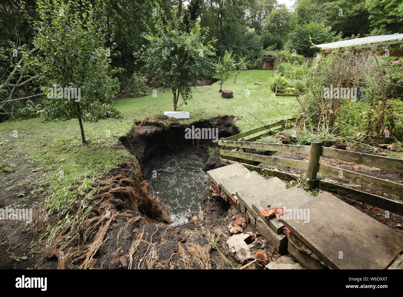 A sinkhole caused by flooding in the garden belonging to Simon Howcroft ...