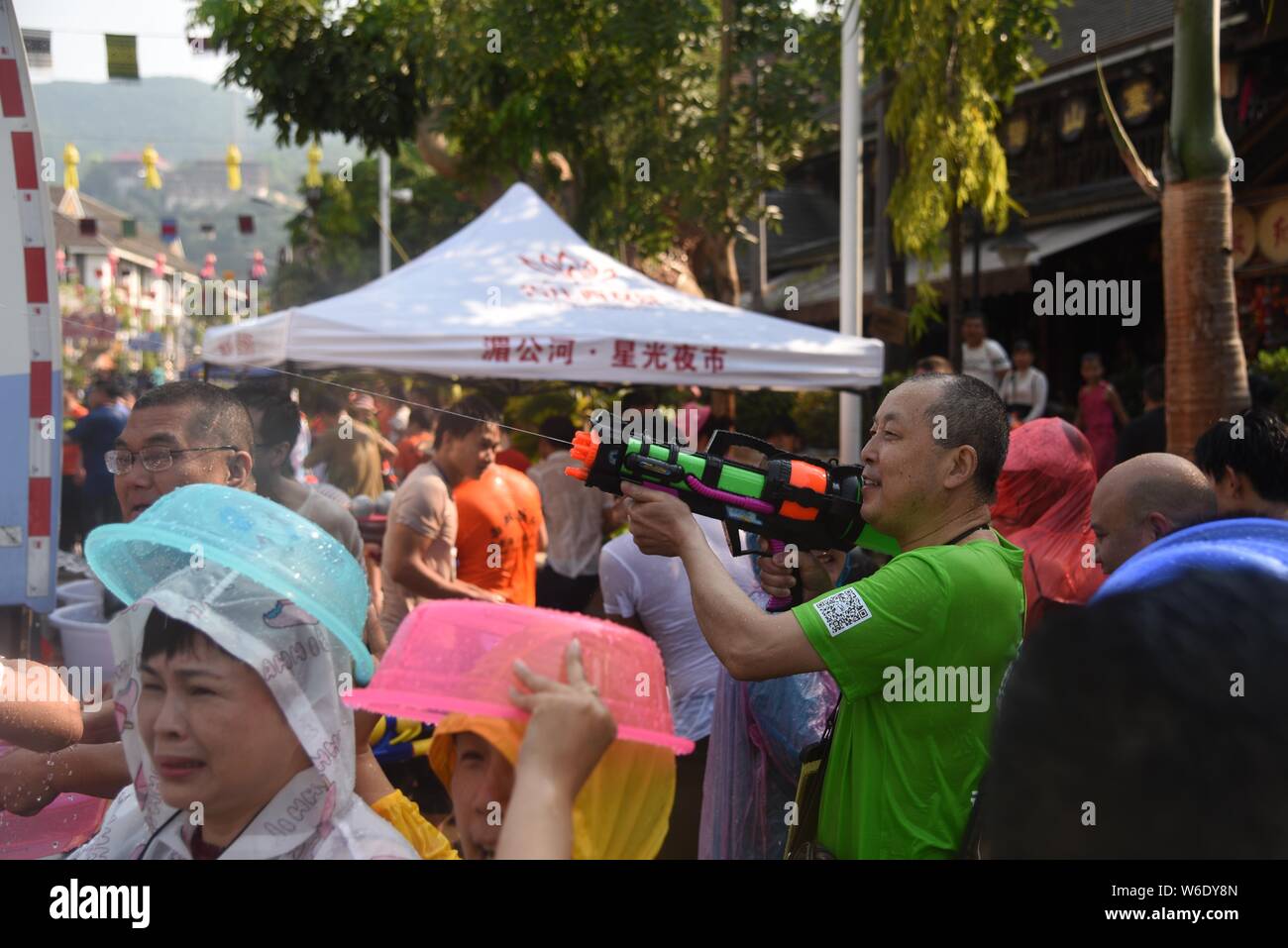 Local people and tourists sprinkle water to celebrate the Water ...