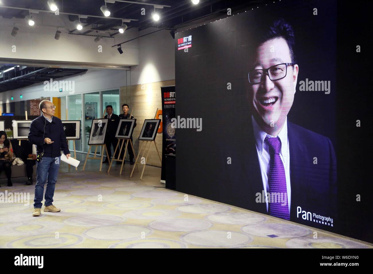 Pan Shiyi, co-founder, Chairman and co-CEO of SOHO China, shows a photo ...