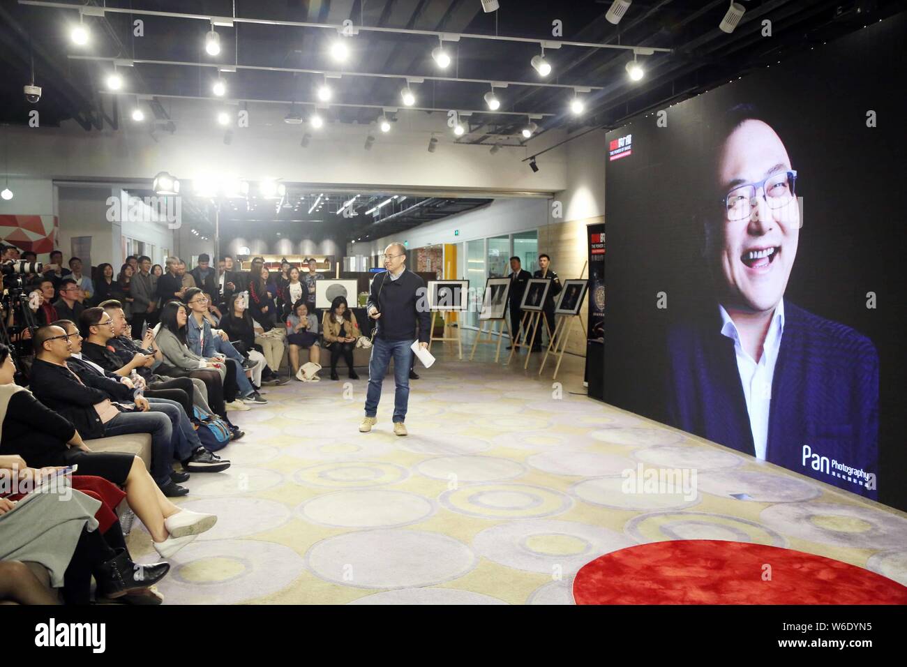 Pan Shiyi, co-founder, Chairman and co-CEO of SOHO China, shows a photo ...