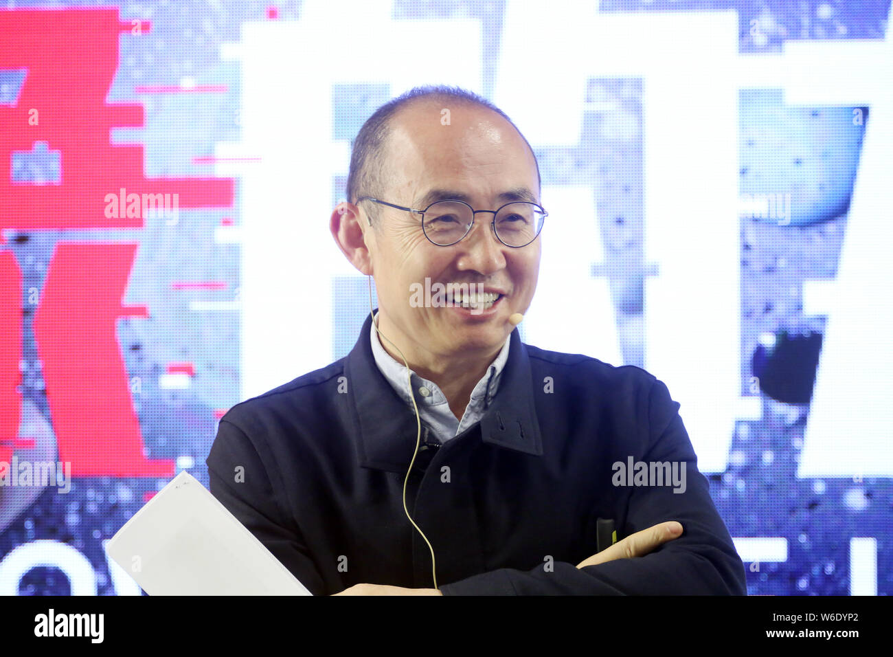 Pan Shiyi, co-founder, Chairman and co-CEO of SOHO China, shows a photo ...