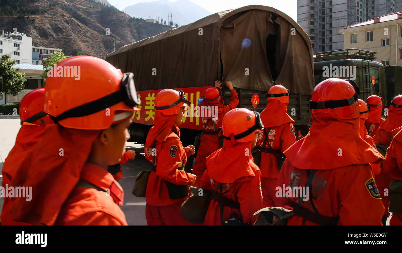 Chinese firefighters line up before taking part in a training session ...