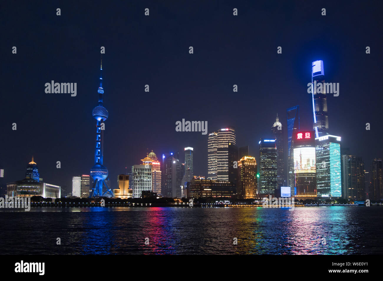 The Shanghai Tower, tallest right, and the Oriental Pearl TV Tower ...