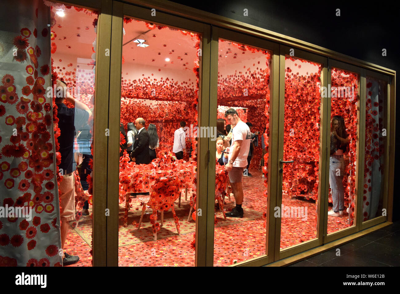 Visitors view 'Flower Obsession', an artwork by Japanese contemporary ...
