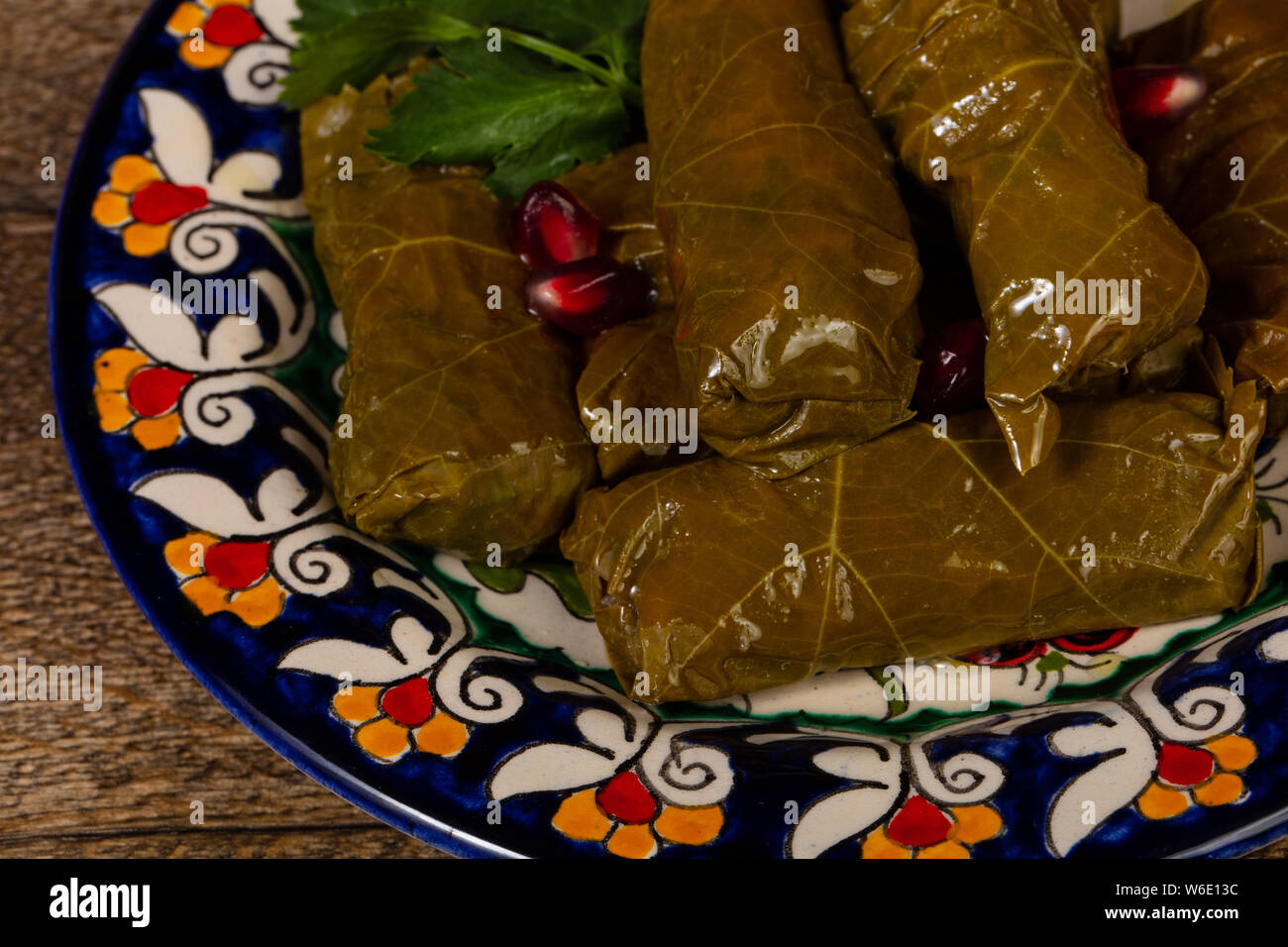Caucasian traditional Dolma - minced meat in grape leaves Stock Photo ...