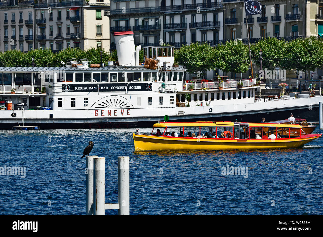 One of the in Geneva so famous yellow boats across the Lake in Geneva ...