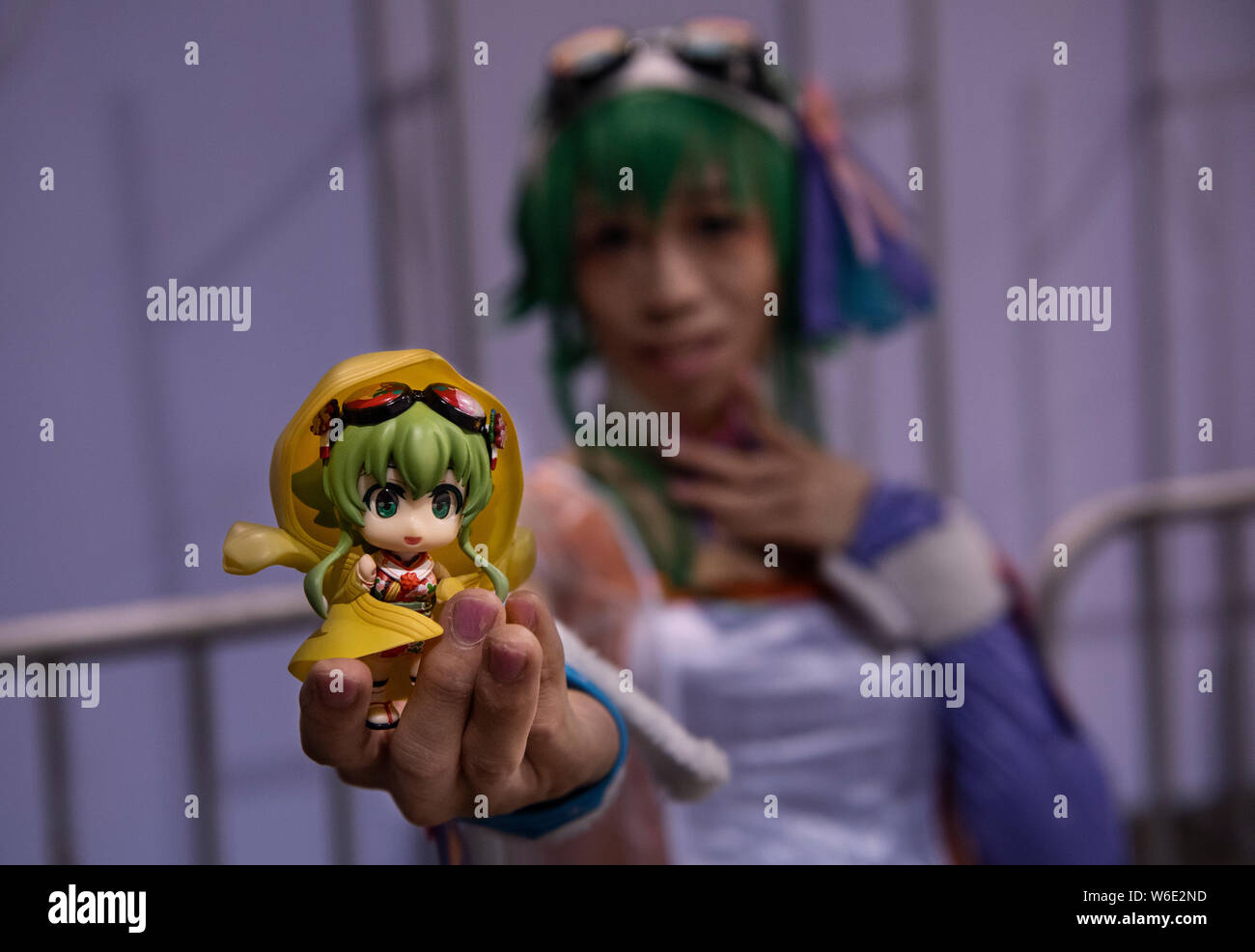 Hong Kong, China. 28th July, 2019. A cosplayer shows off her character ...