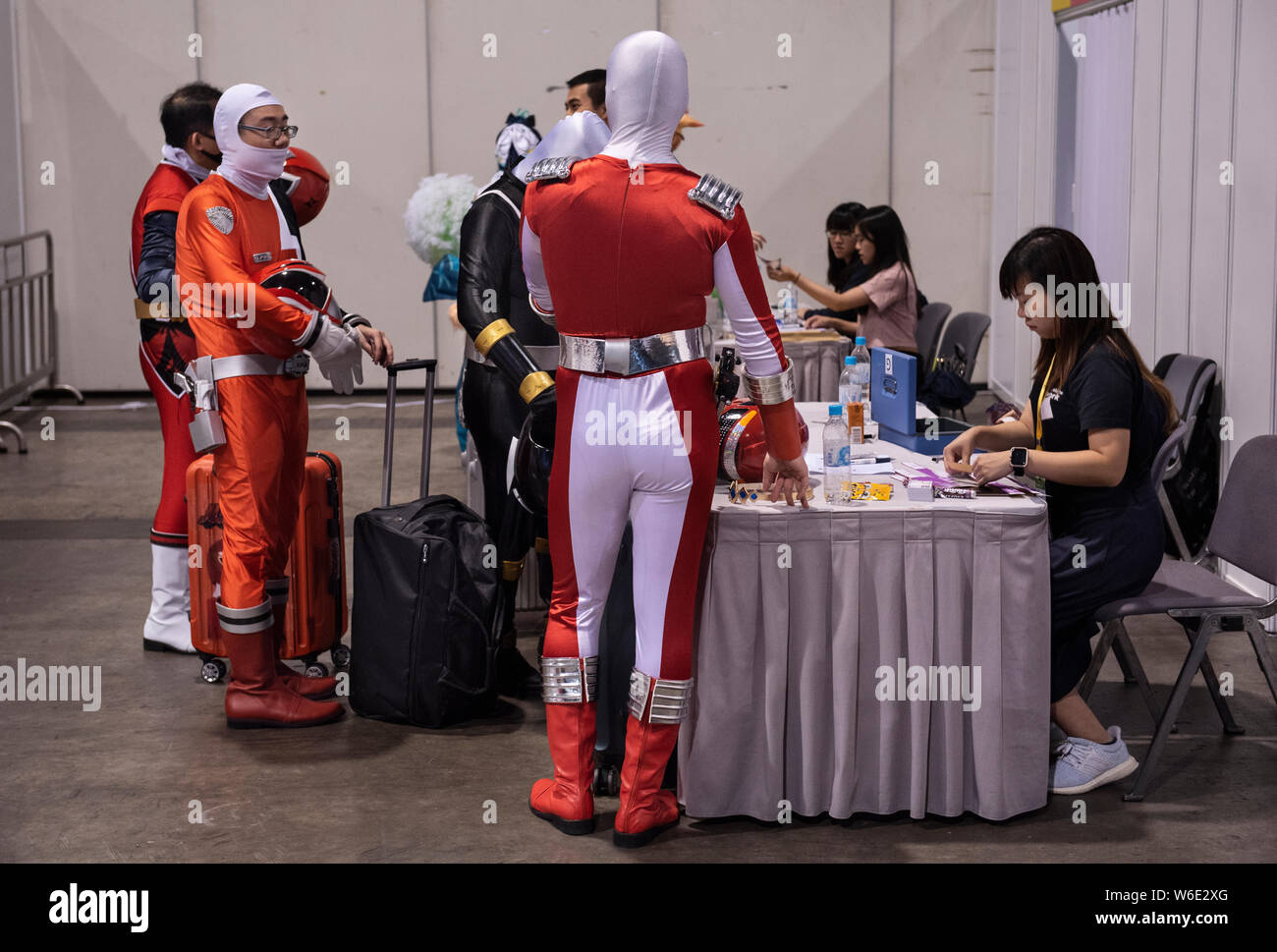 Hong Kong, China. 28th July, 2019. Cosplayers queue during the Ani-com ...