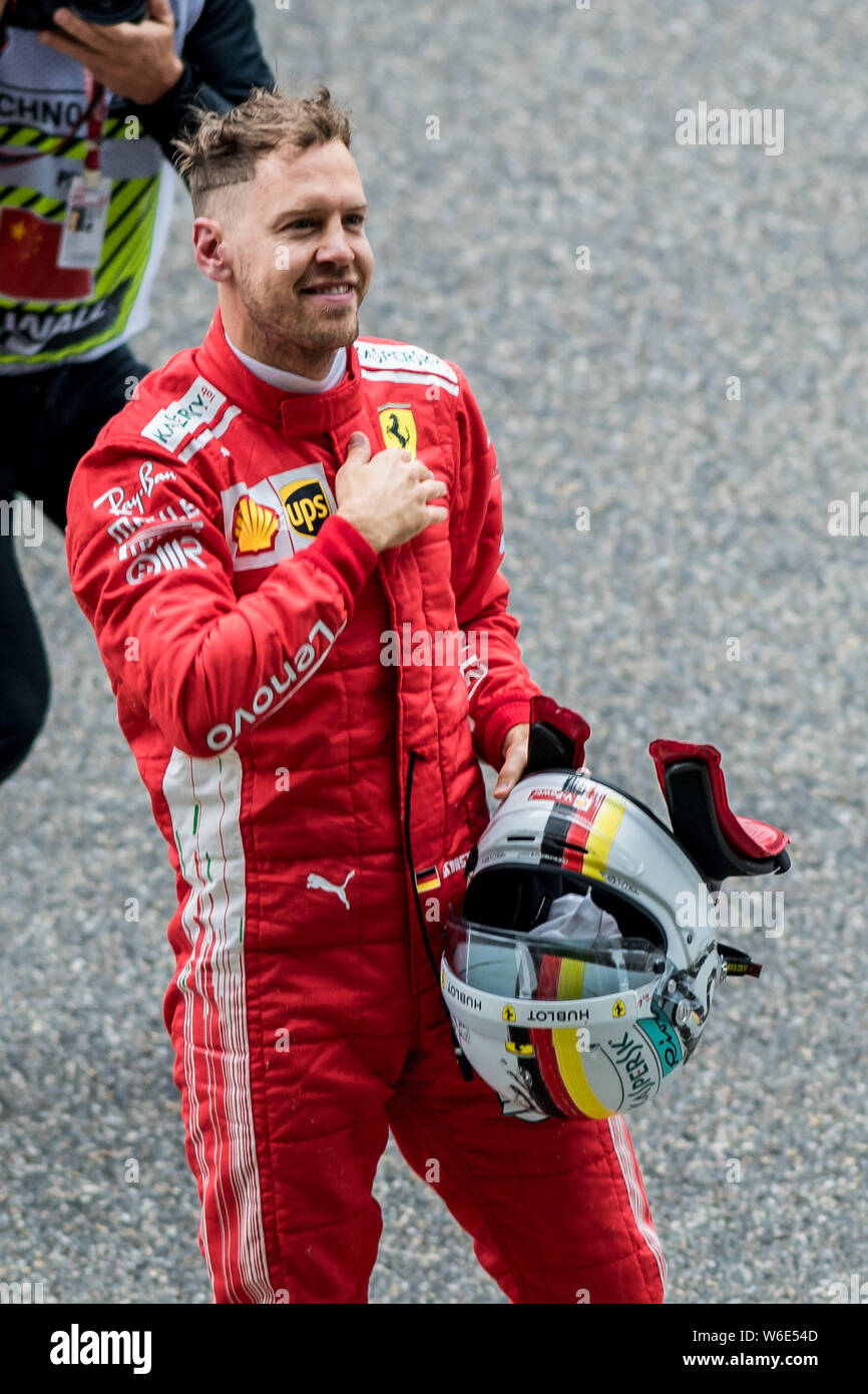 German F1 Sebastian Vettel of Ferrari reacts after winning the pole ...