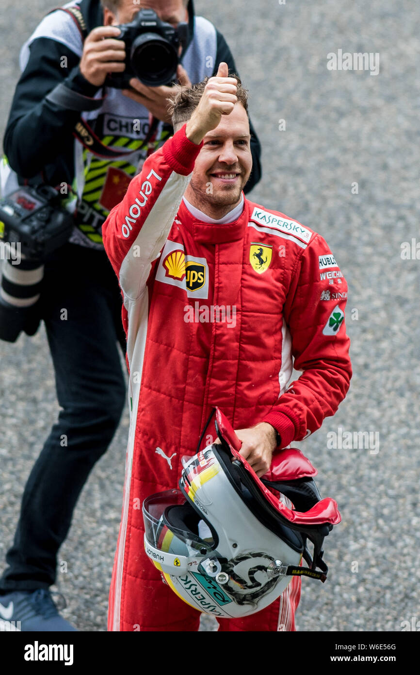 German F1 Sebastian Vettel of Ferrari reacts after winning the pole ...