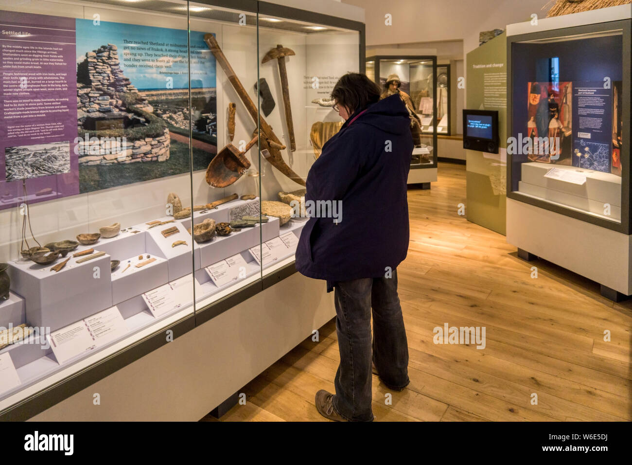 A visitor looking at the exhibits in the Shetland Museum & Archives in ...