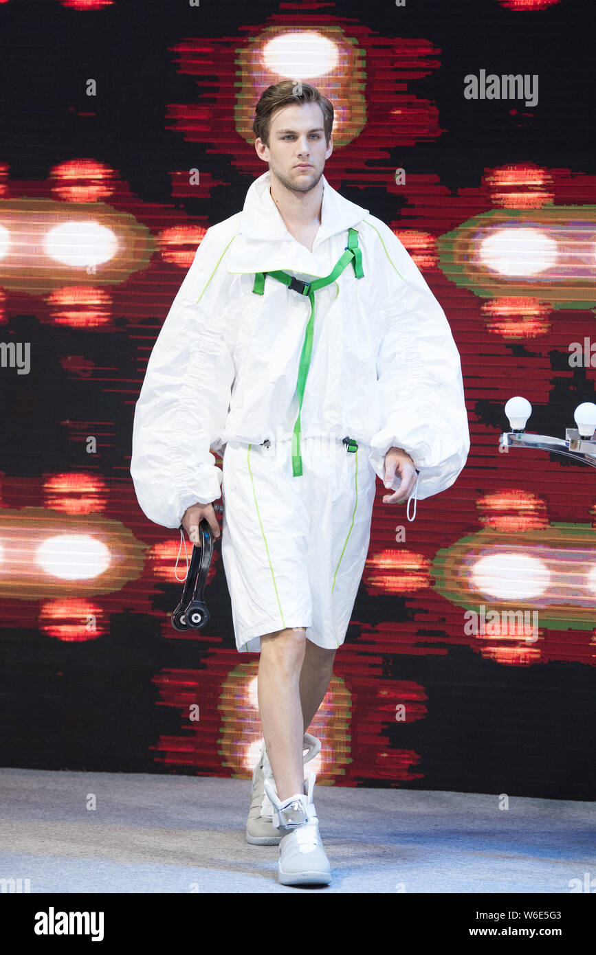 A model displays a new creation at the BASF press conference during the ...