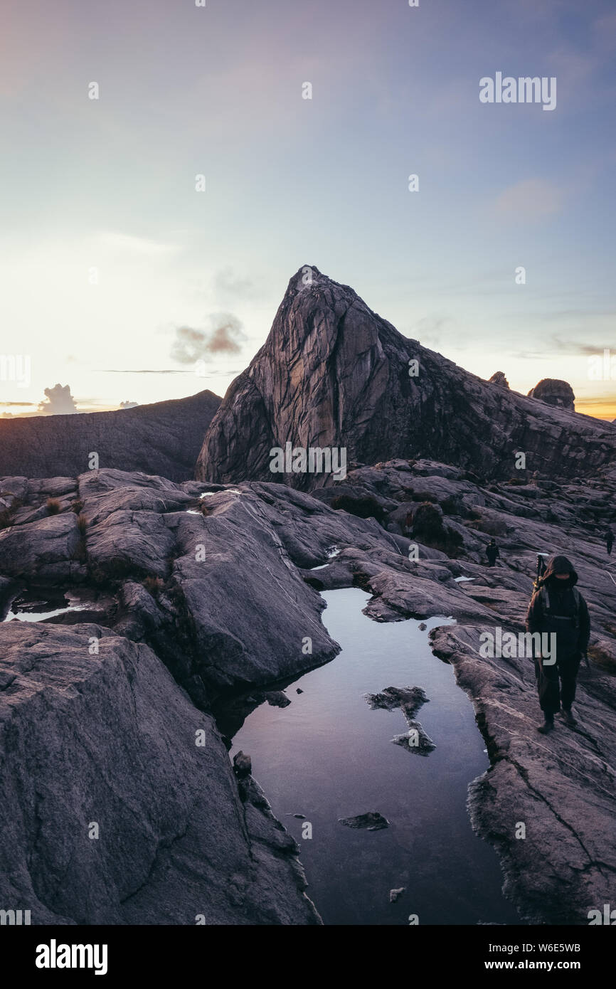 summit view with man at sunrise Stock Photo - Alamy