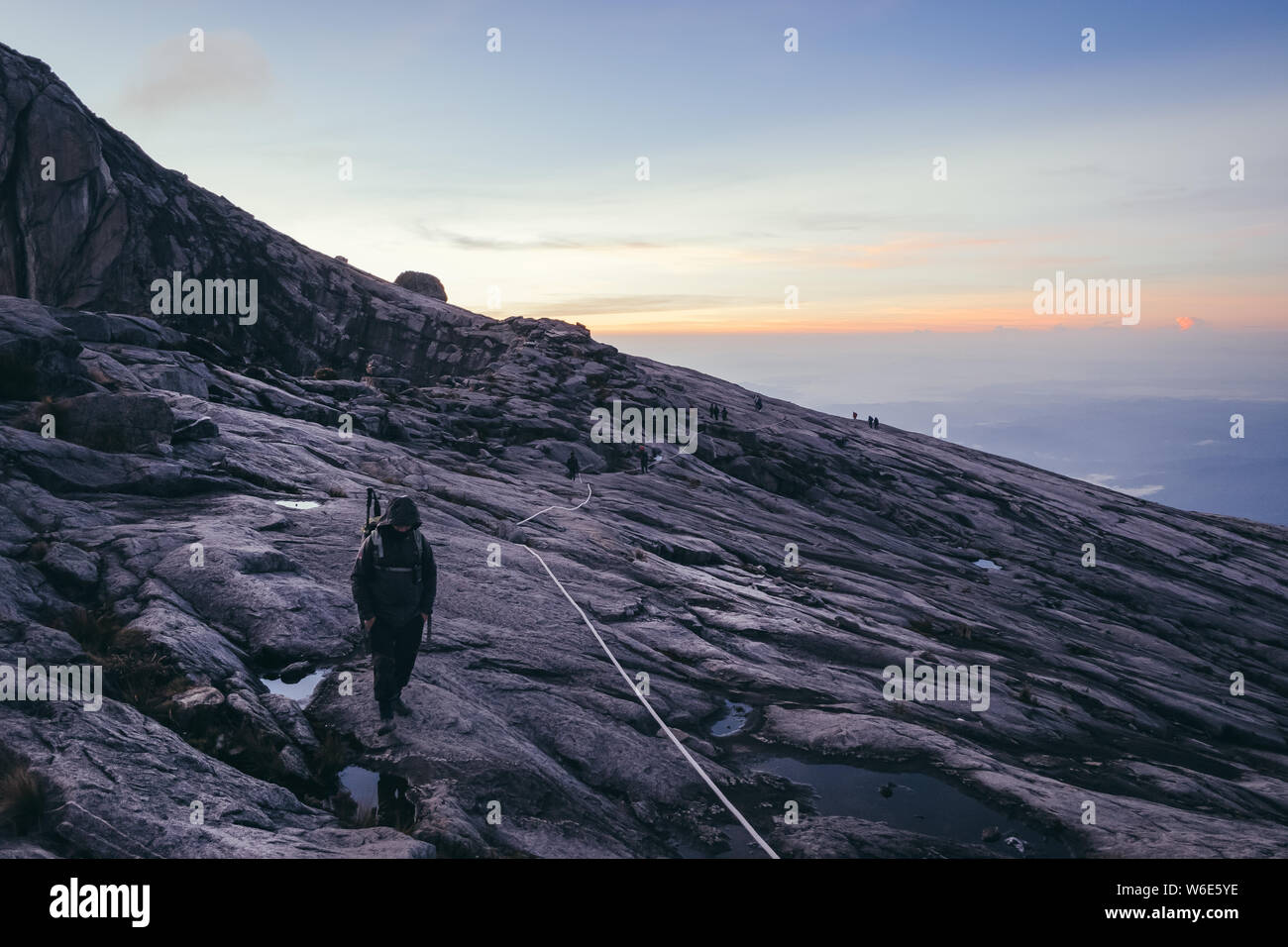 summit view with man at sunrise Stock Photo - Alamy