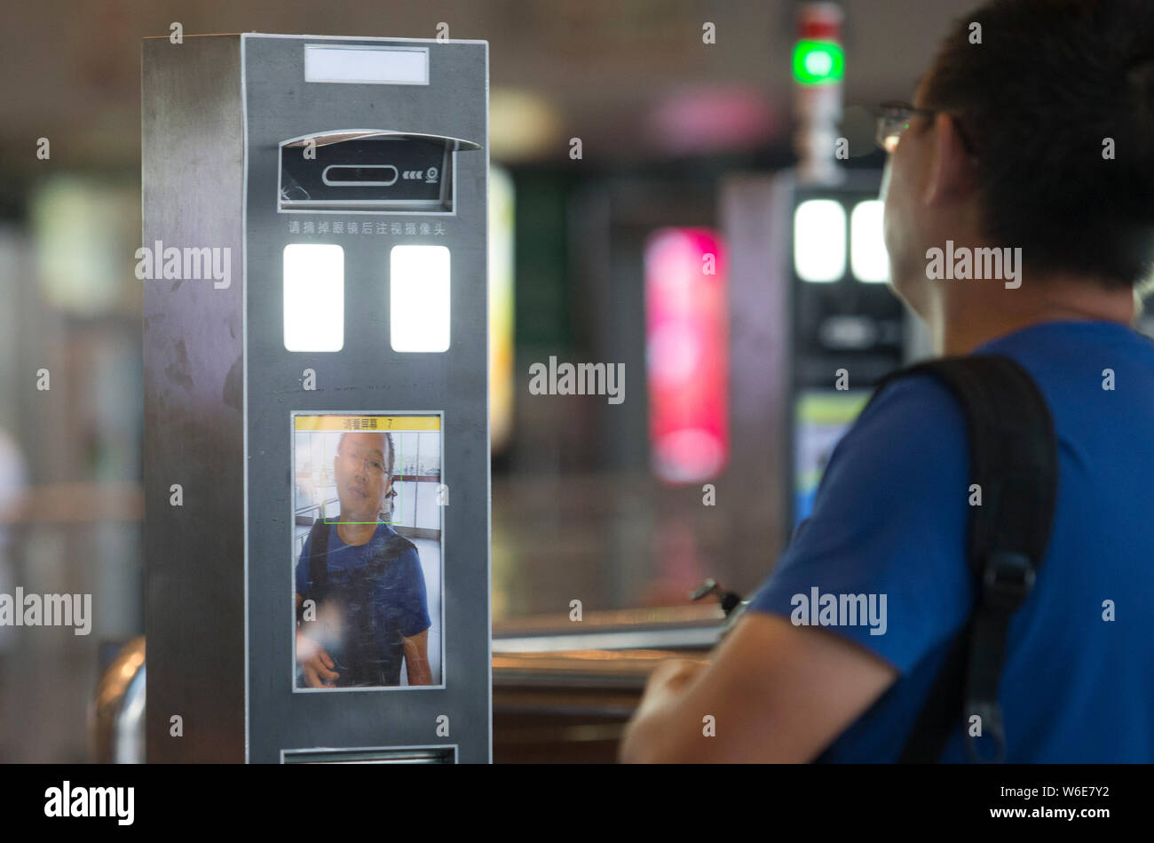 --FILE--A Chinese passenger has his face scanned by a face recognition ...
