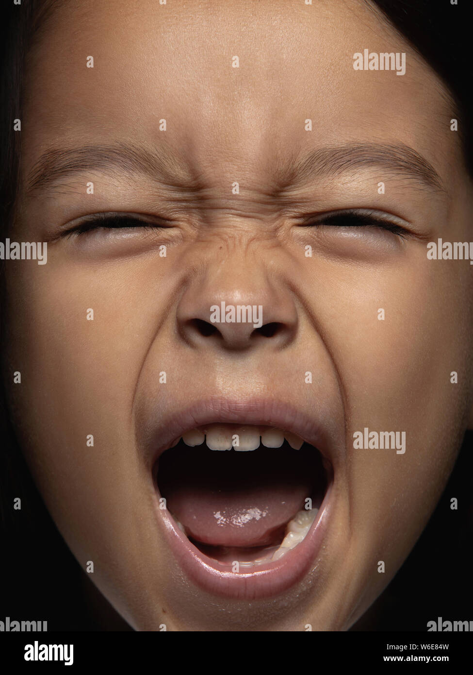 Close up portrait of little and emotional asian girl. Highly detail ...