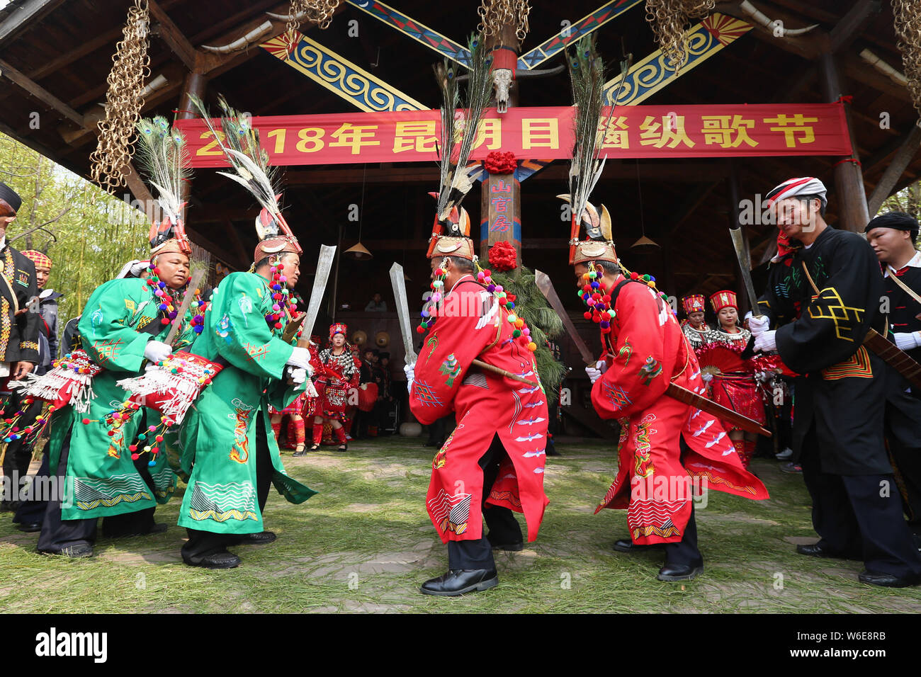 Chinese people of Jingpo ethnic group wearing traditional costumes and ...