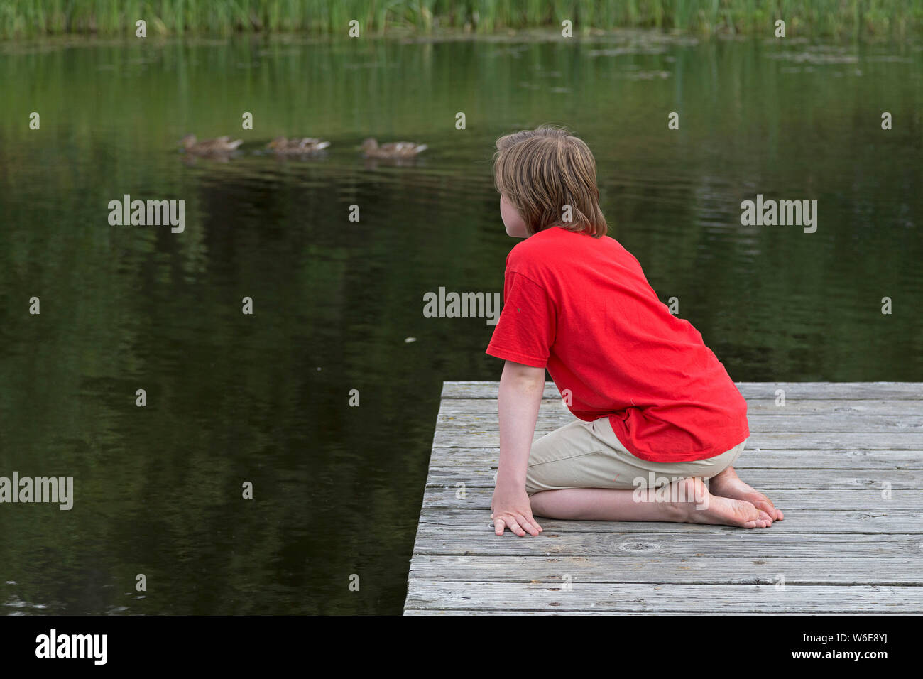 Boy Squatting High Resolution Stock Photography and Images - Alamy