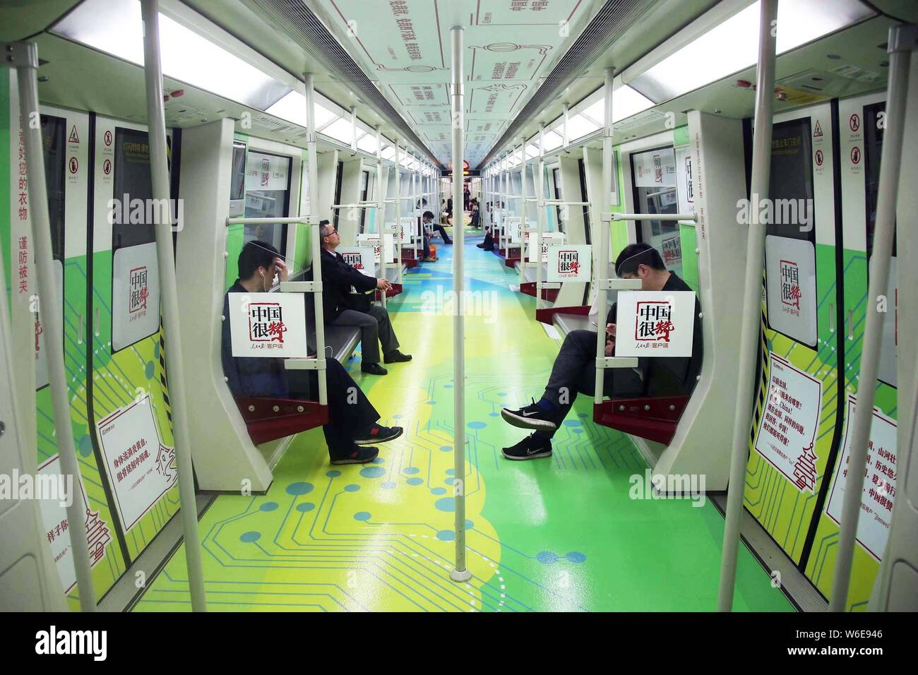 Passengers take the first "China-themed" subway train on the Metro Line ...