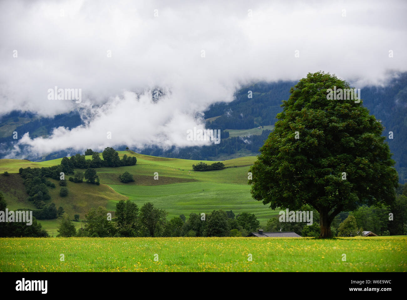A view of the countryside under clouds.Tirol is a western Austrian ...
