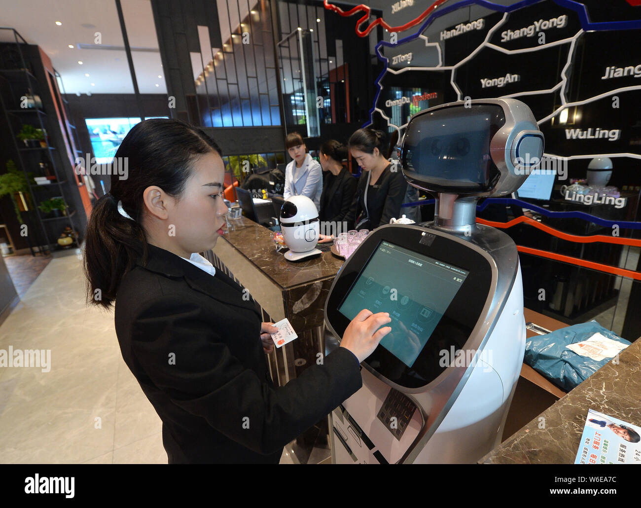 Robot operates hi-res stock photography and images - Alamy
