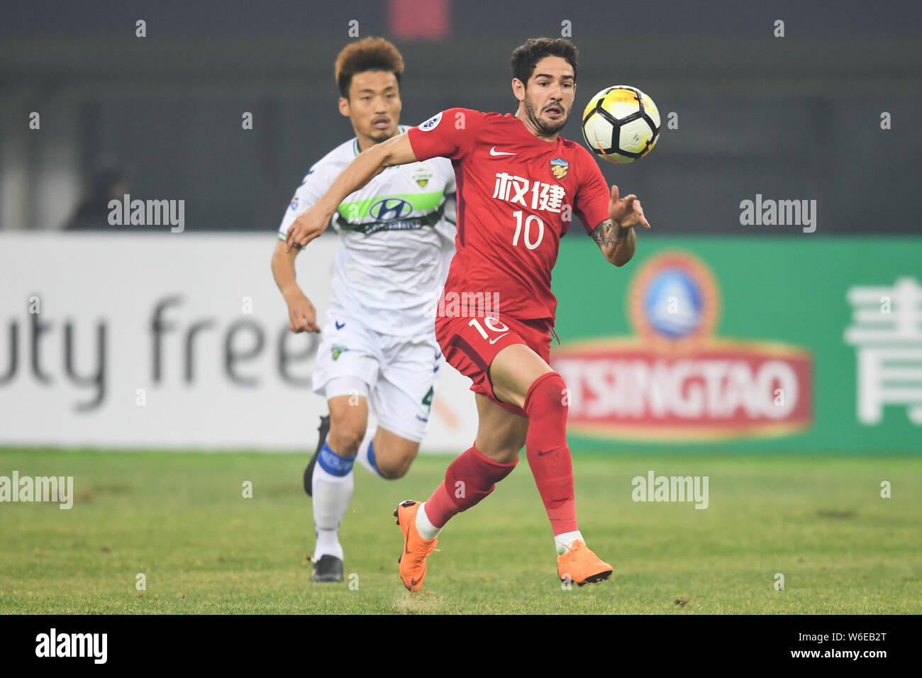 Brazilian football player Alexandre Rodrigues da Silva, right, known as ...